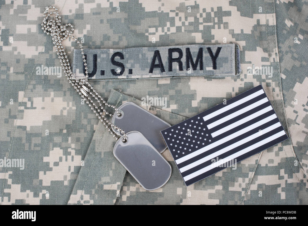 US flag patch with dog tag on Army Combat Uniform background Stock ...