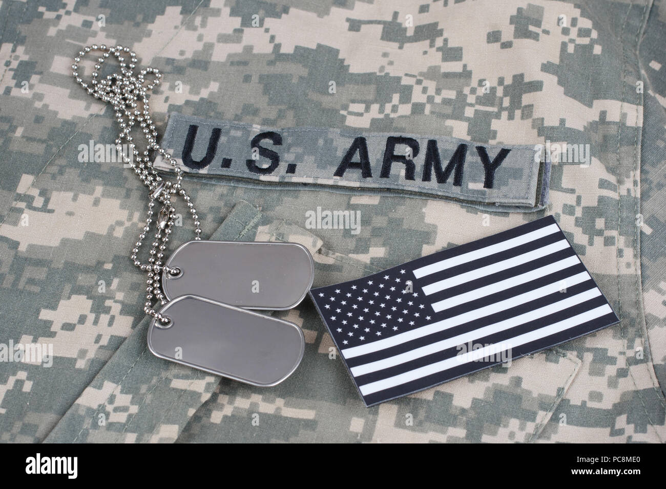 US flag patch with dog tag on Army Combat Uniform background Stock ...