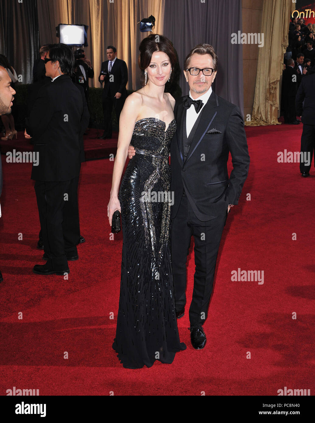 Gary Oldman and Wife 124 arriving at the Oscar - 84th Academy Awards ...