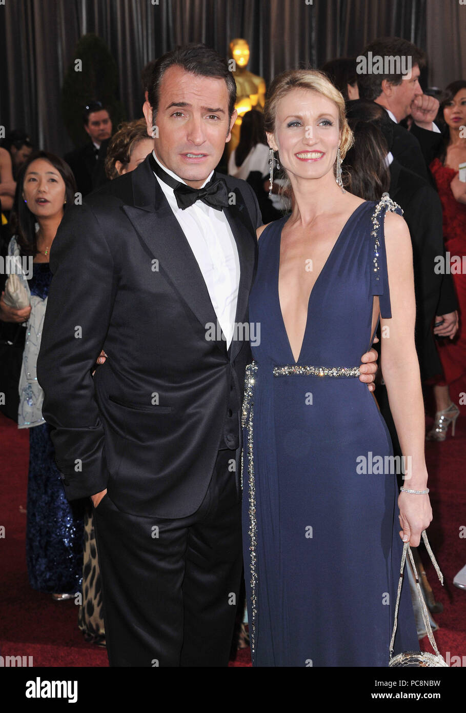 Jean DuJardin and wife 200 arriving at the Oscar - 84th Academy Awards ...