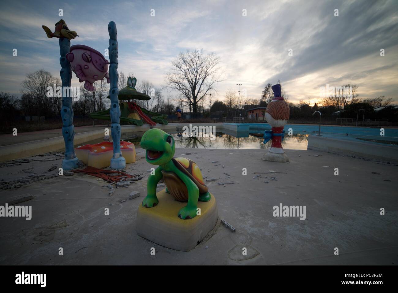 Abandoned waterpark with old statues and water slides Stock Photo - Alamy