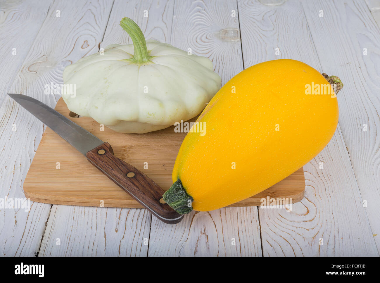 Vegetables (zucchini and patisson) on the board Stock Photo - Alamy