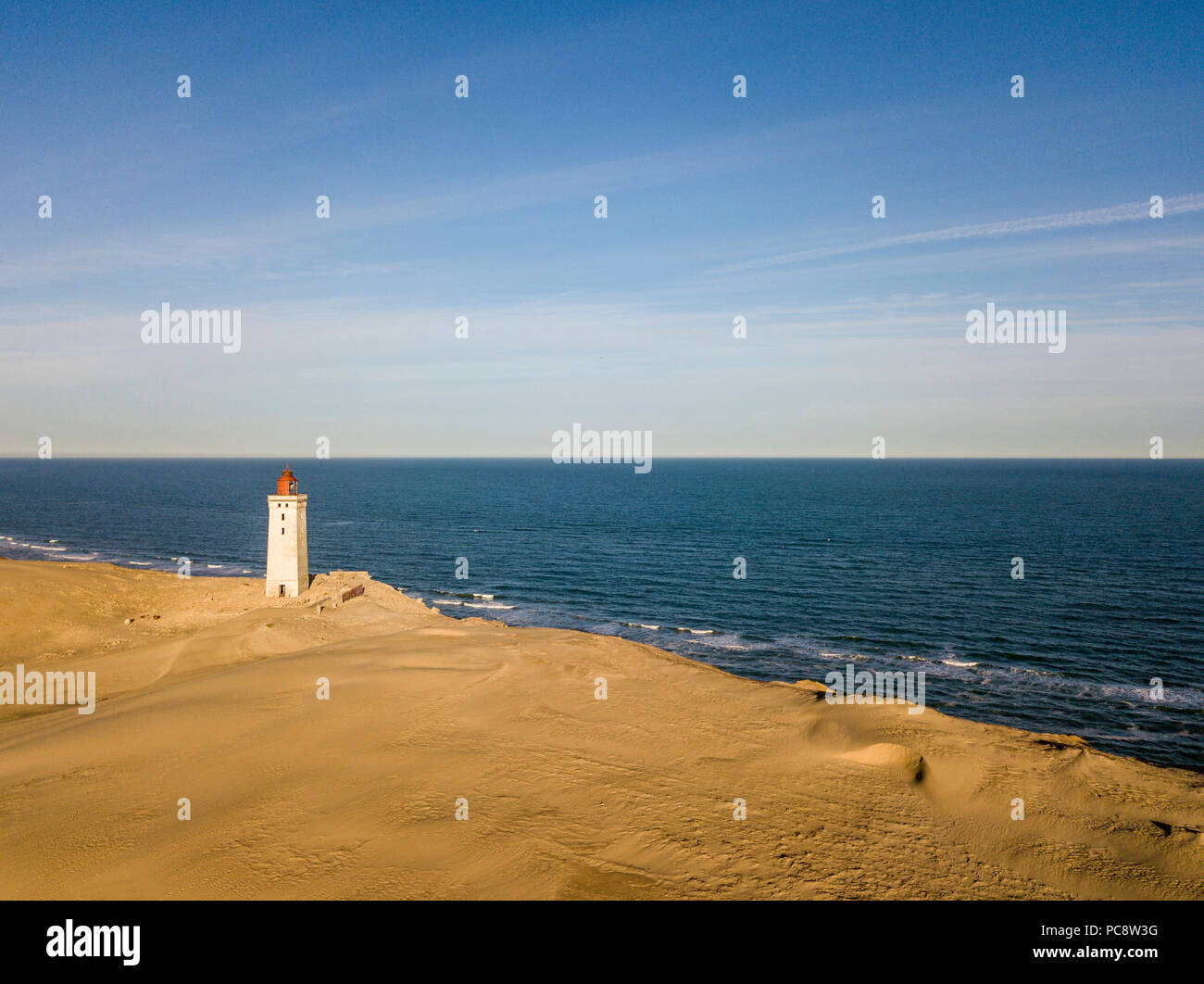 Aerial view of Rubjerg Knude lighthouse buried in sands on the coast of ...