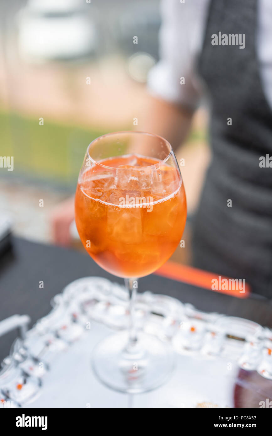 Aperol spritz cocktail in misted glass, selective focus. Alcoholic ...