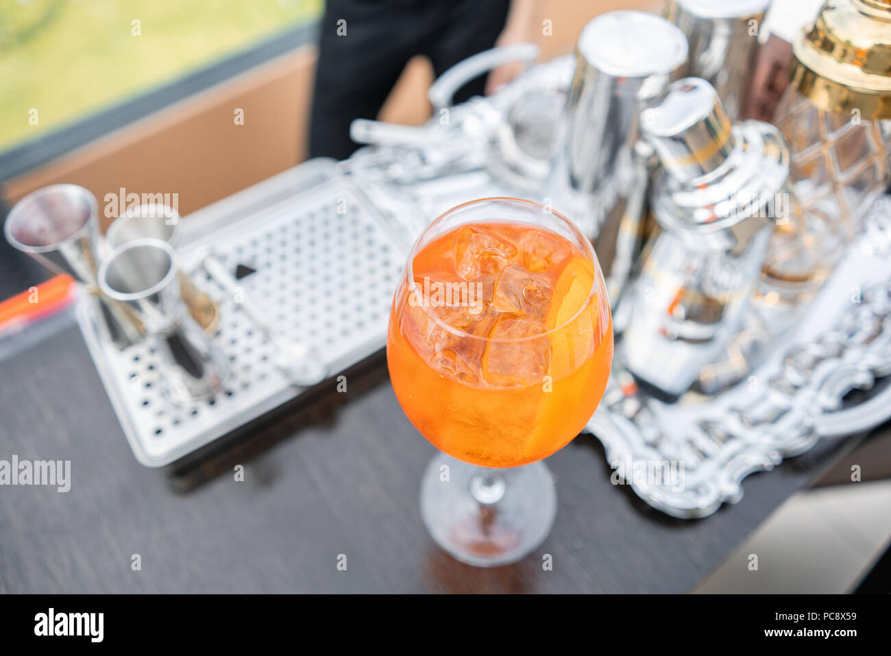 Aperol spritz cocktail in misted glass, selective focus. Alcoholic ...