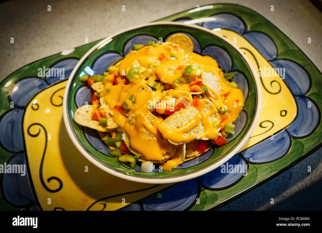 Montreal, Canada, July 31, 2018.Bowl of nacos with peppers and melted ...