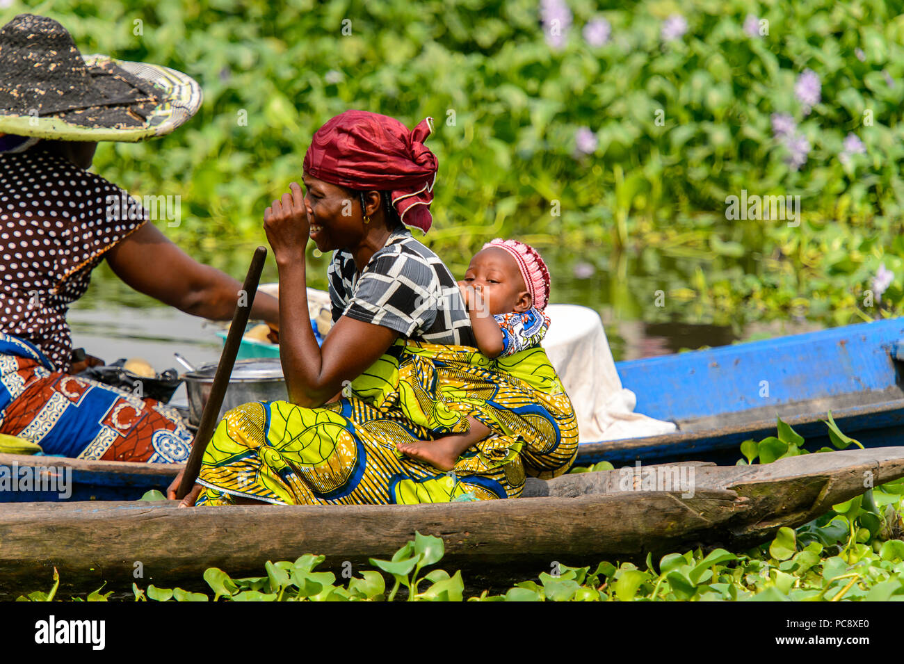 GANVIE, BENIN - JAN 11, 2017: Unidentified Beninese woman with her baby ...