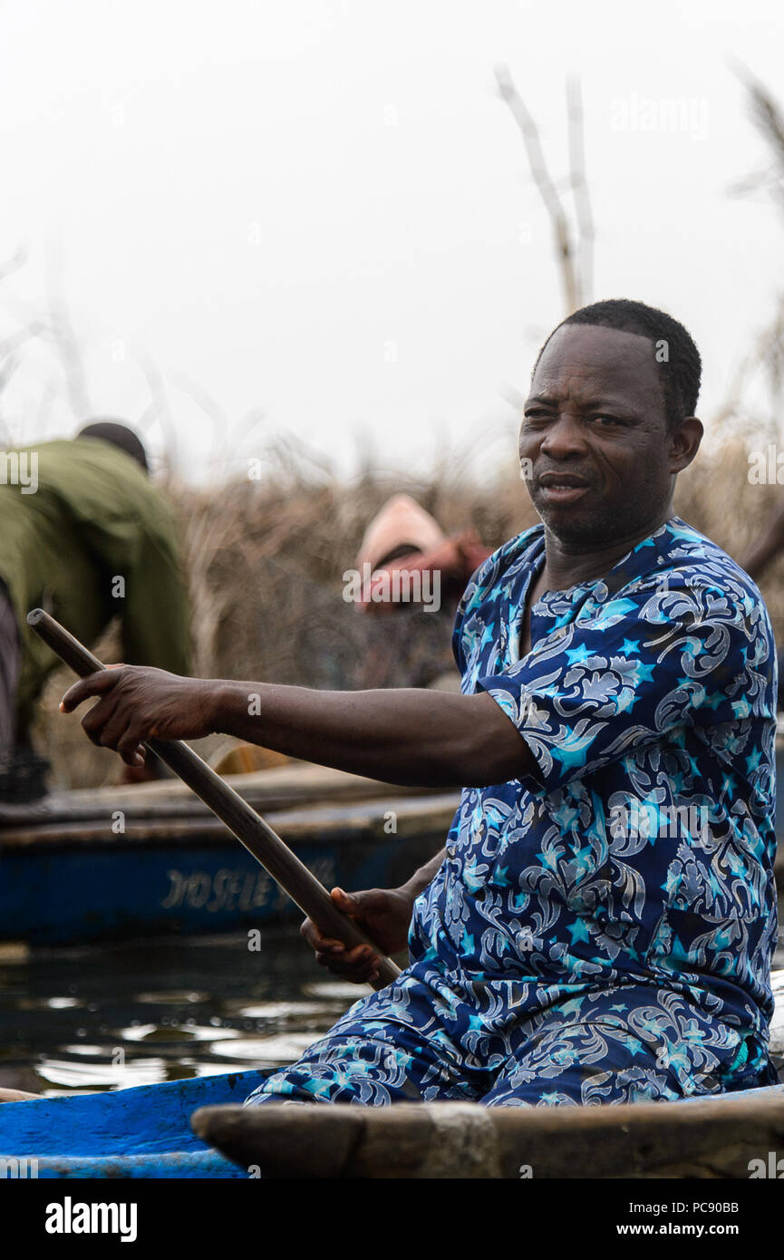 GANVIE, BENIN - JAN 11, 2017: Unidentified Beninese man sails in a ...
