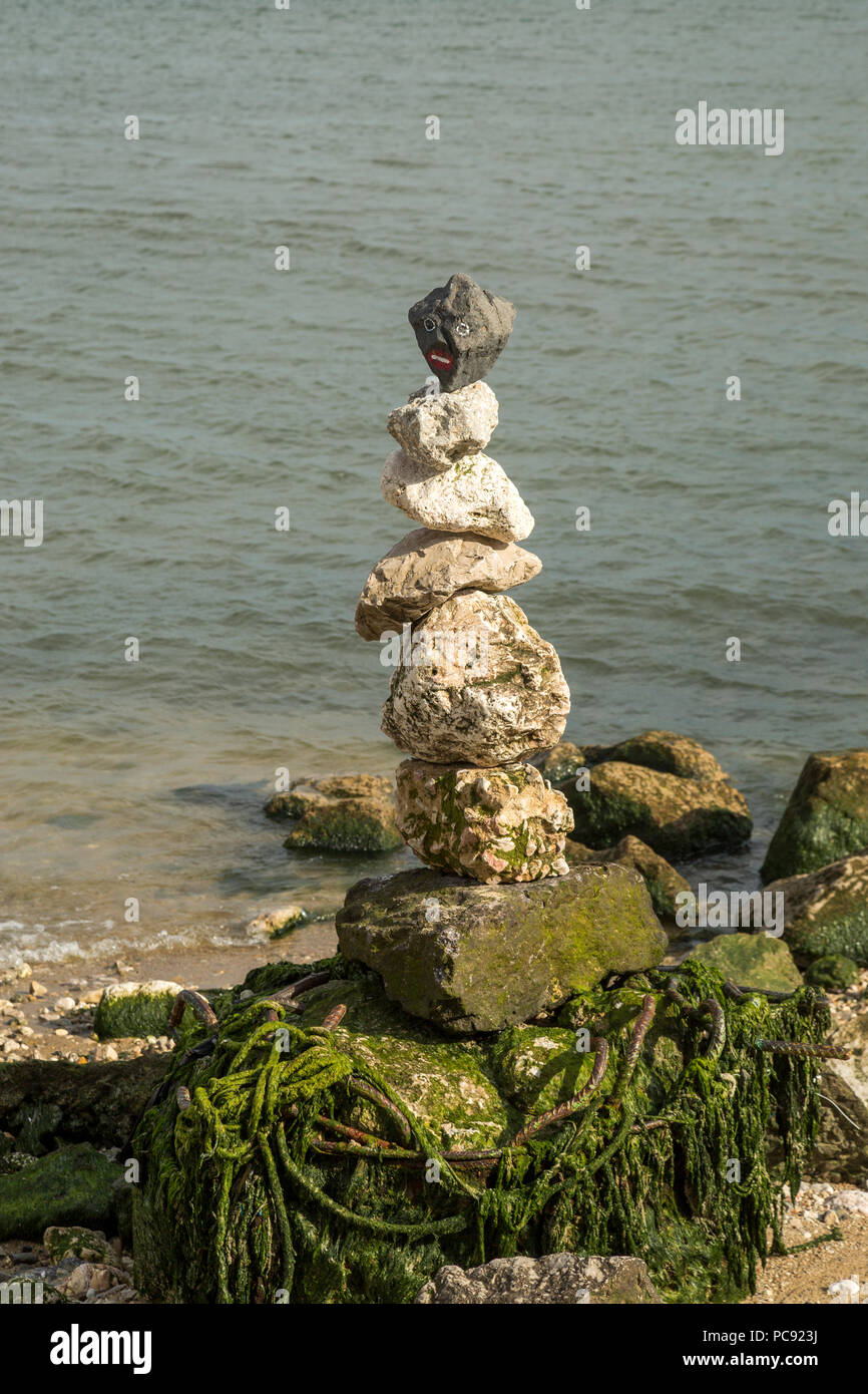 Stacked rocks on the beach in Lisbon, Portugal. These rocks also are ...