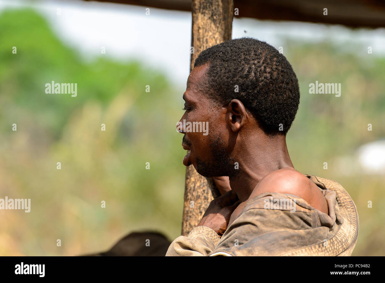 DANKOLI, BENIN - JAN 12, 2017: Unidentified Beninese man stands near a ...