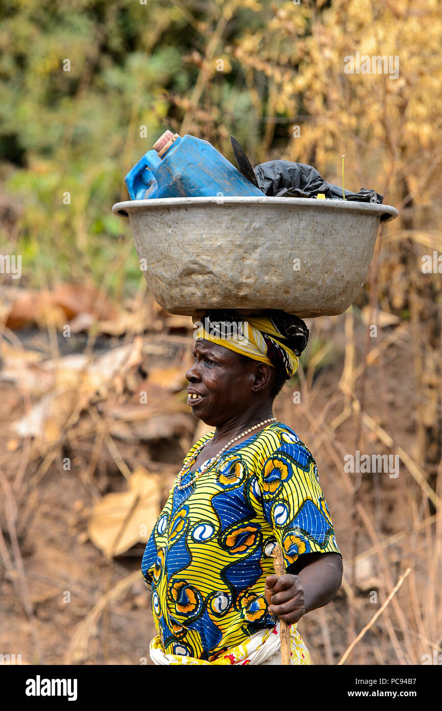 DANKOLI, BENIN - JAN 12, 2017: Unidentified Beninese woman carries a ...