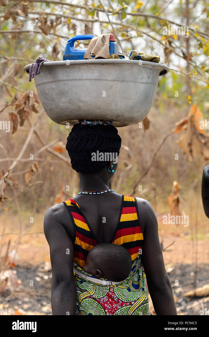 DANKOLI, BENIN - JAN 12, 2017: Unidentified Beninese woman carries a ...