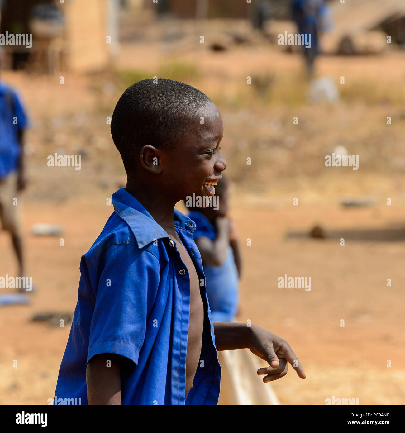 PIRA, BENIN - JAN 12, 2017: Unidentified Beninese little boy in a blue ...
