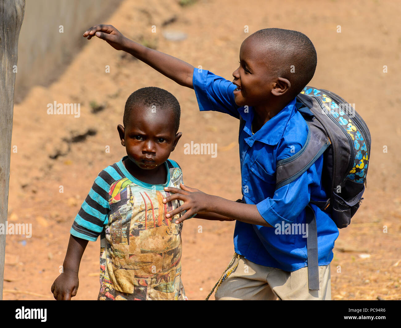 PIRA, BENIN - JAN 12, 2017: Unidentified Beninese little boy in a blue ...