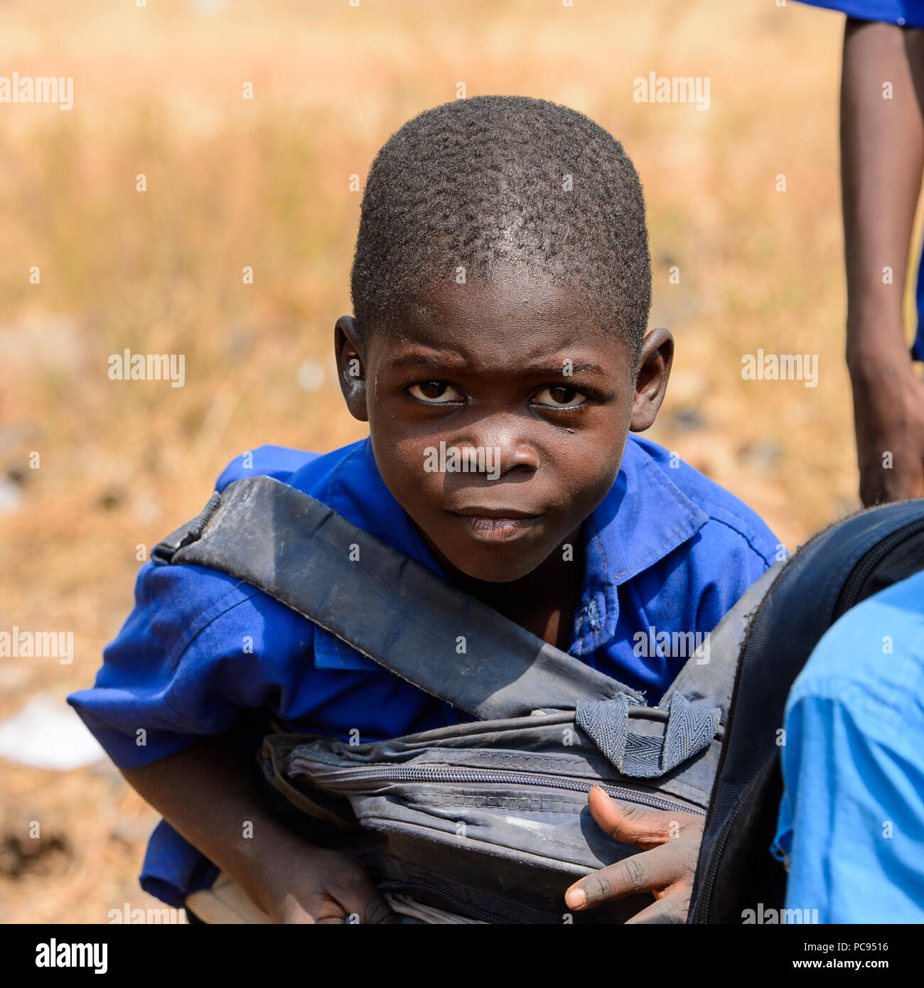 PIRA, BENIN - JAN 12, 2017: Unidentified Beninese little boy in a blue ...