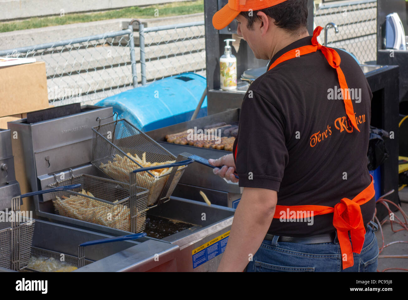 Man cooking french fries hi-res stock photography and images - Alamy