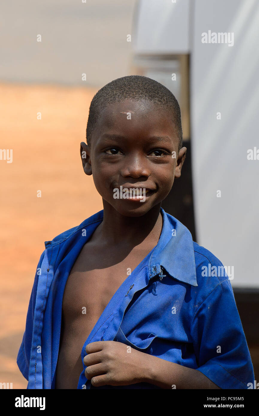 PIRA, BENIN - JAN 12, 2017: Unidentified Beninese little boy in a blue ...