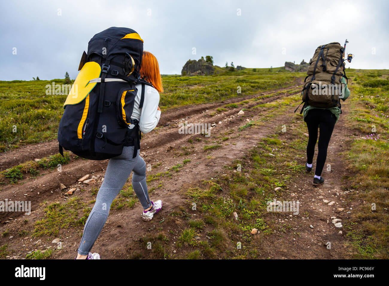 Travel Lifestyle and survival concept rear view. Two hiking women with ...