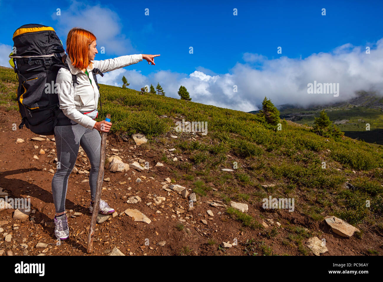 Travel Lifestyle and survival concept rear view. Hiking woman with ...