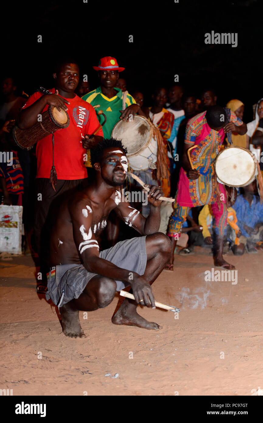 SOKODE, TOGO - JAN 12, 2017: Unidentified Togolese man eats burning ...