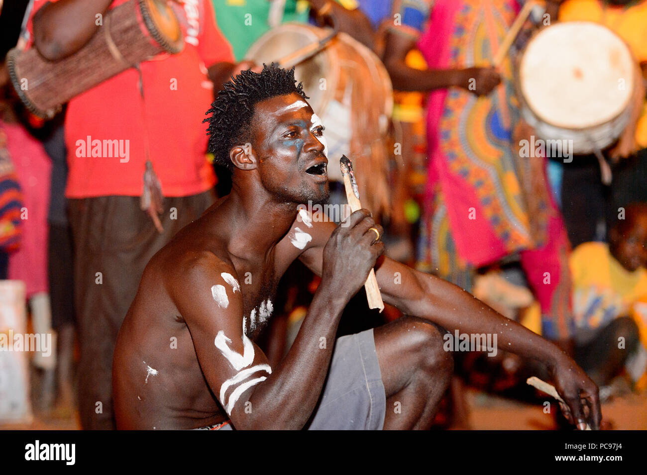 SOKODE, TOGO - JAN 12, 2017: Unidentified Togolese man eats burning ...