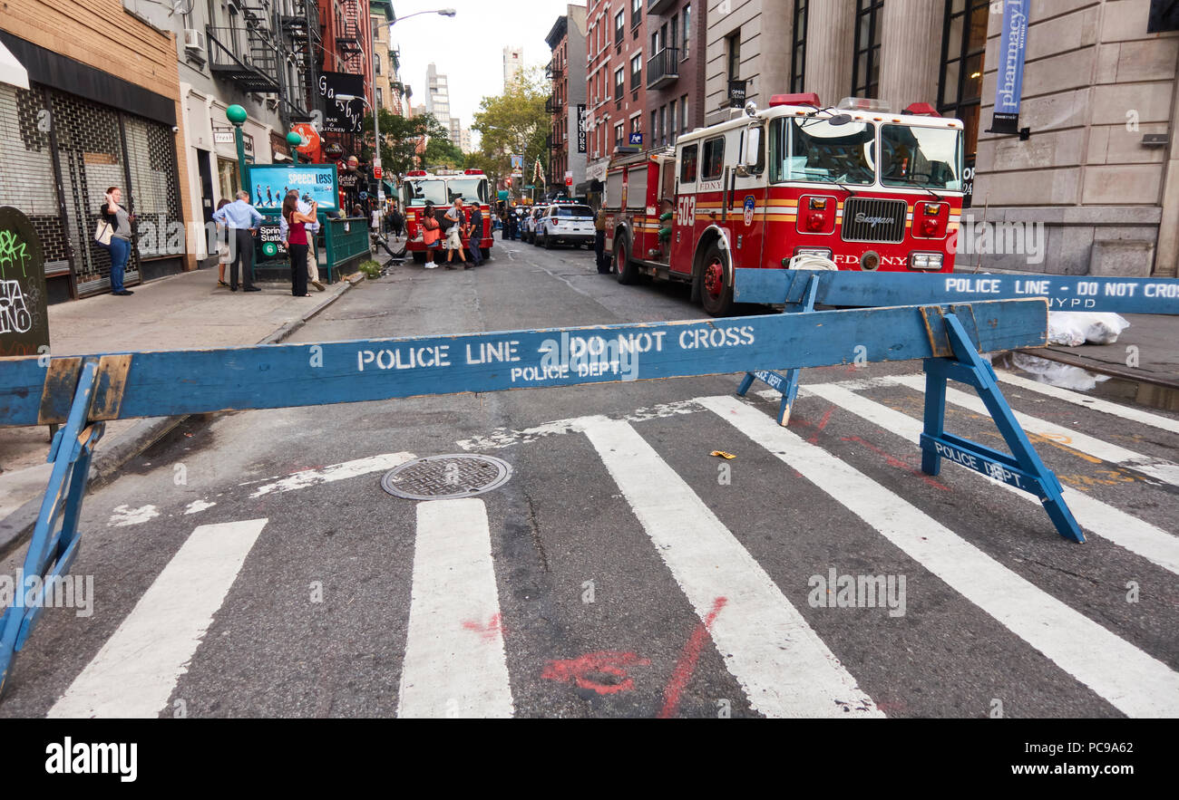 Police Line barriers stopping car traffic through a East Village street ...