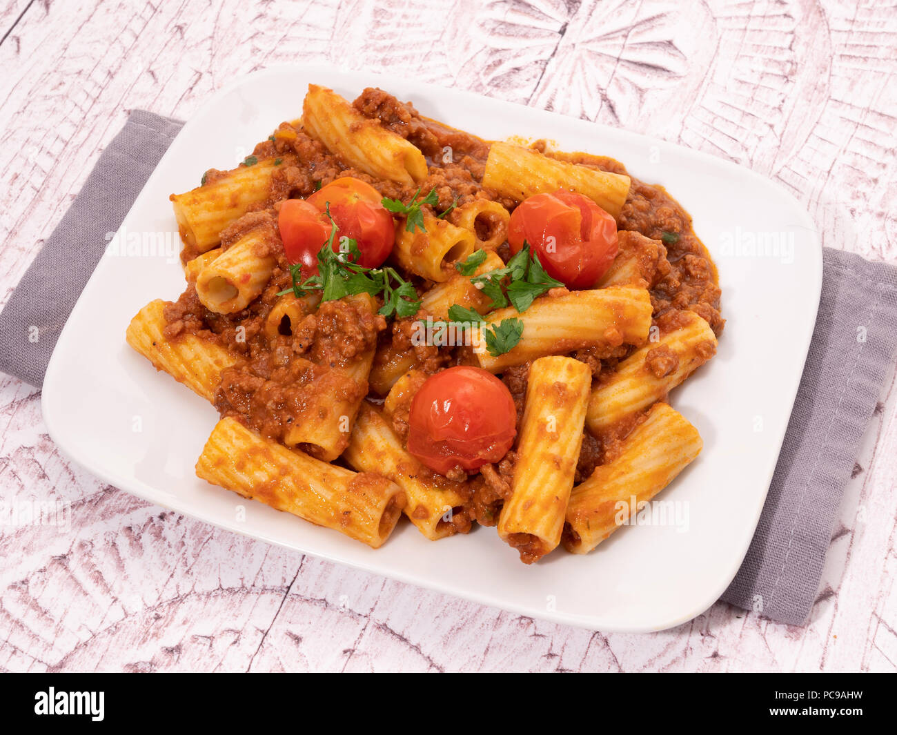 Beef Ragu with rigatoni pasta and cherry tomatoes Stock Photo - Alamy