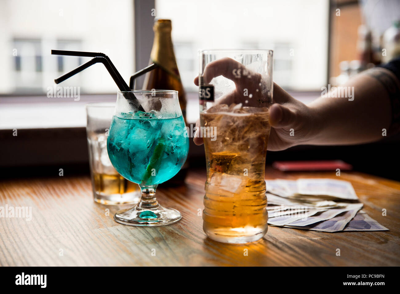 Hand grabbing a pint hi-res stock photography and images - Alamy