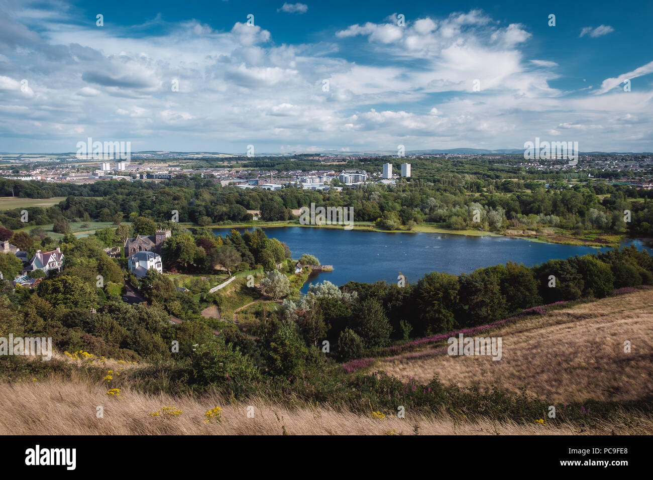 Cityscape the of Edinburgh, view from hill on the Duddingston Loch ...