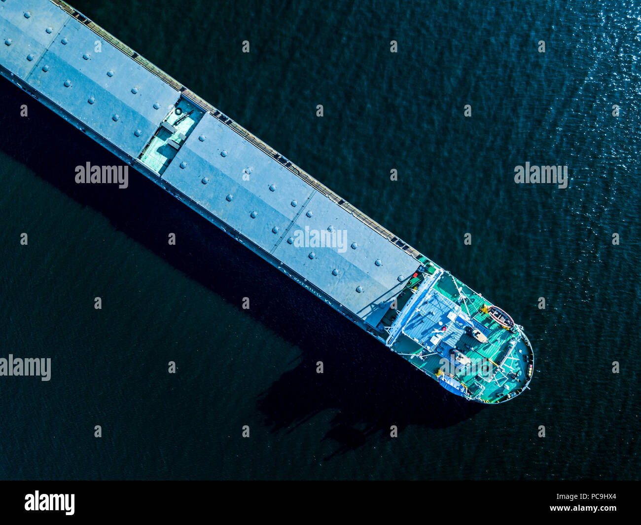 close up part of big barge on the sea water texture directly above ...
