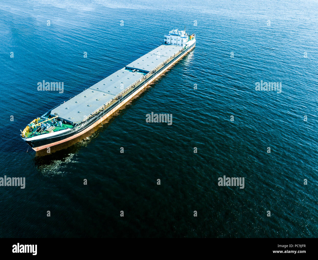 aerial view of large freighter shipping on the sea isolated on a summer ...