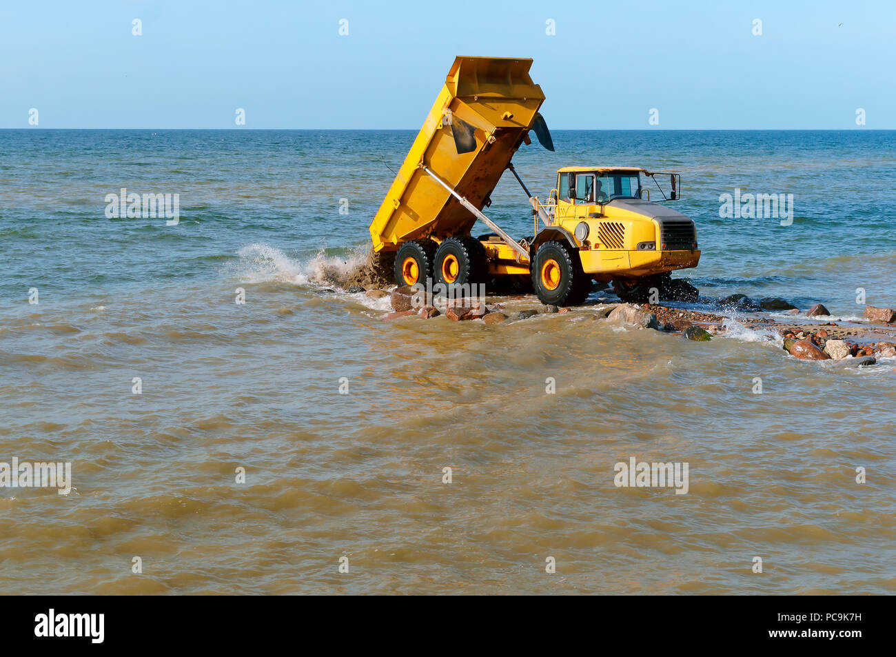 construction equipment on the shore, the construction of breakwaters ...