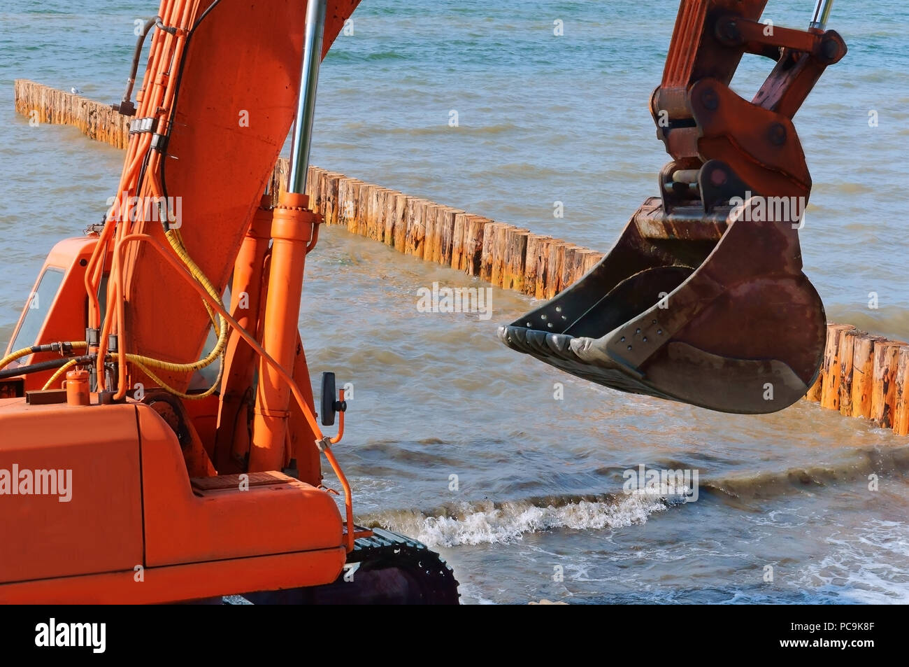 construction equipment on the shore, the construction of breakwaters ...