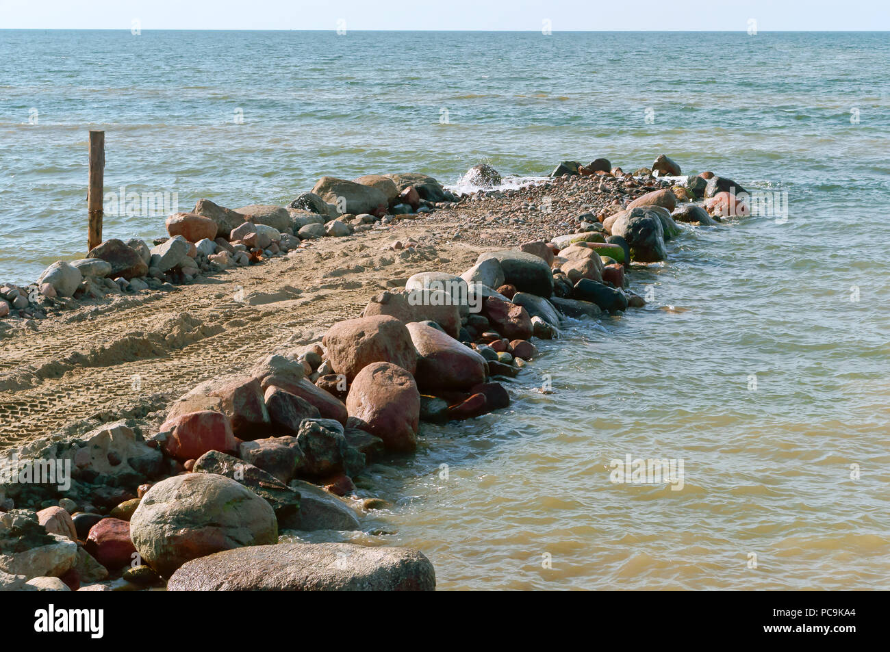 construction equipment on the shore, the construction of breakwaters ...