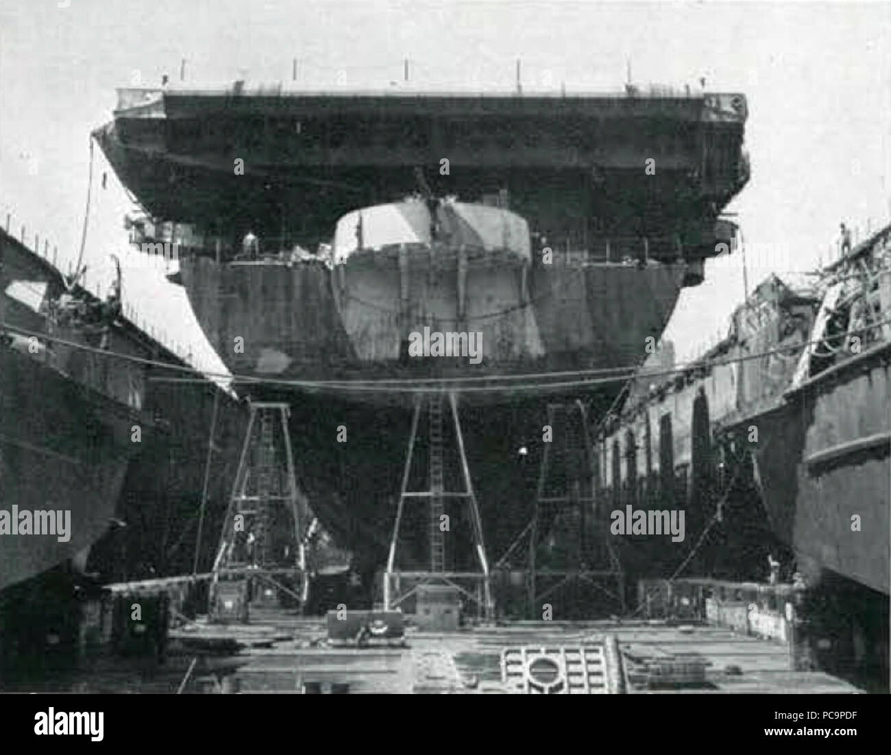 Aft view of USS Lunga Point (CVE-94) in a floating drydock at Guam in ...