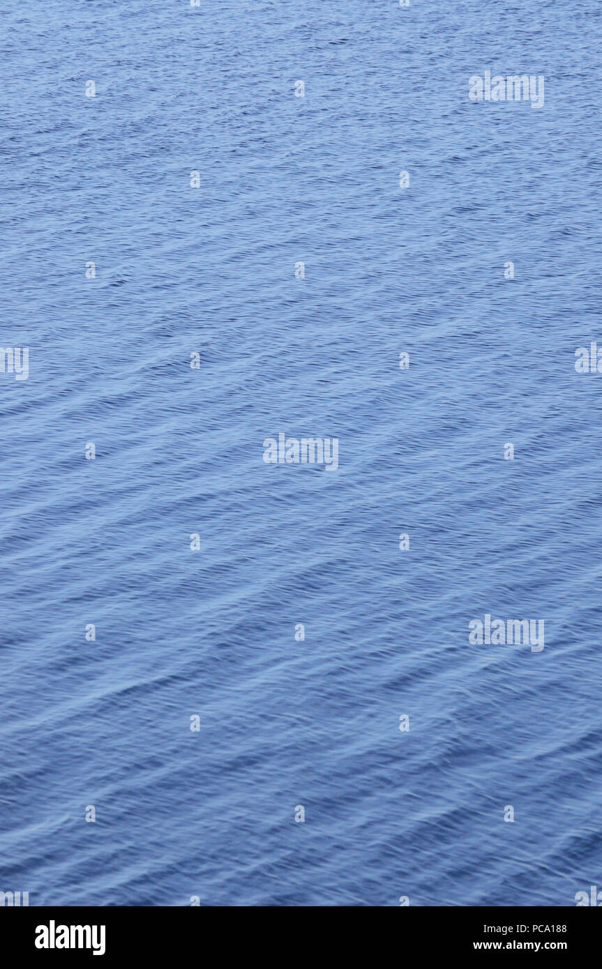 Vertical ocean water waves background pattern, abstract blue gentle ...