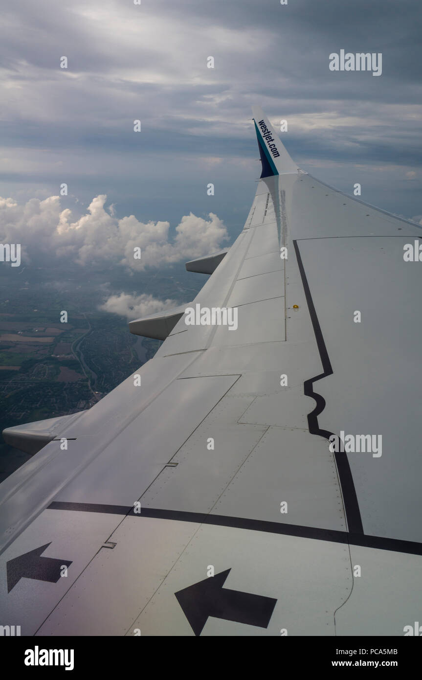 View from an airplane window over the wing Stock Photo - Alamy