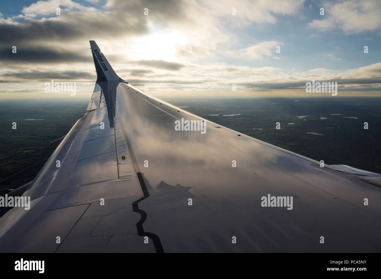 View from an airplane window over the wing Stock Photo - Alamy