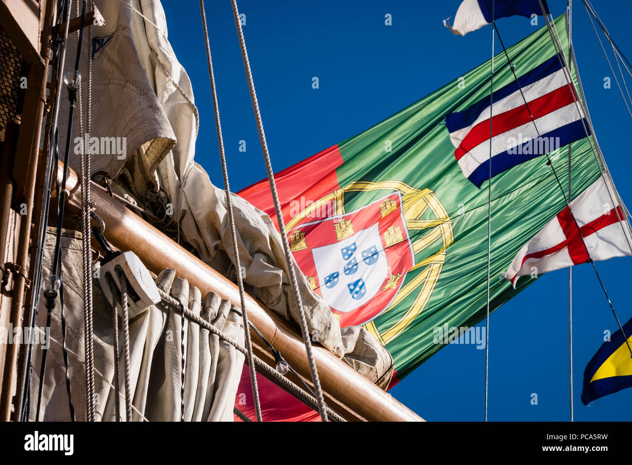 Flags flying from the rigging of the Portuguese tall ship Sagres Stock ...