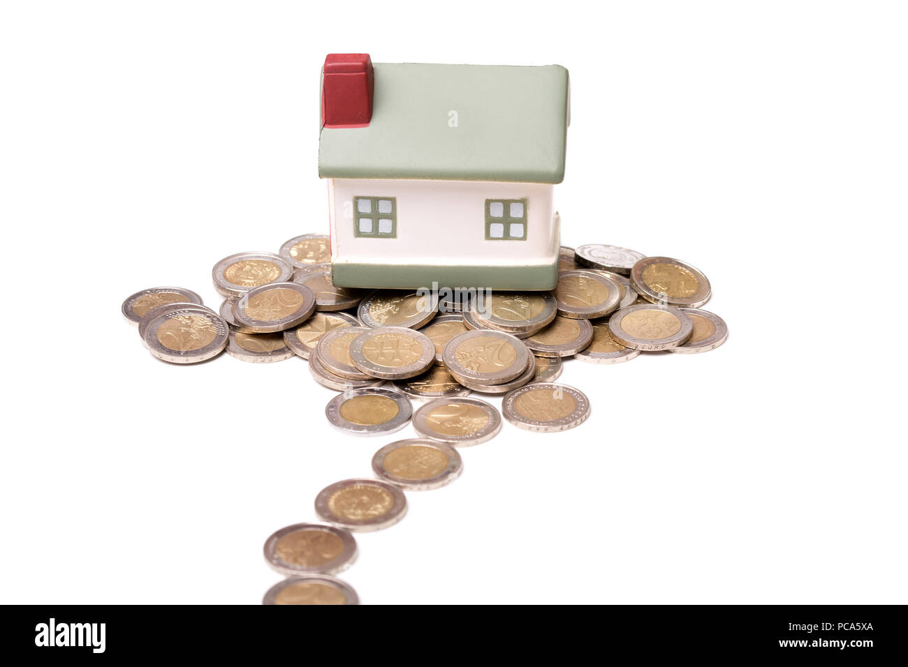 small house and coins, concept, isolated on white background Stock ...