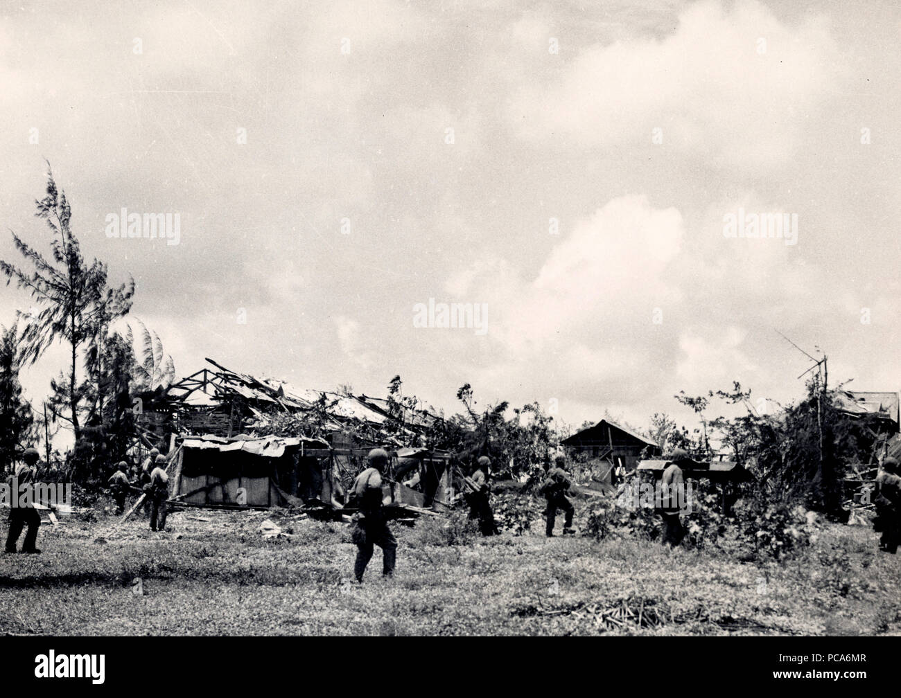 World War II Photo - Marine riflemen move in on destoryed Japanese army ...