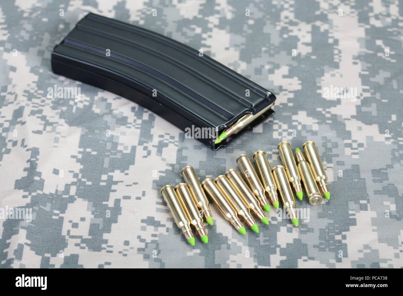 5.56 mm cartridges on US ARMY uniform background Stock Photo - Alamy