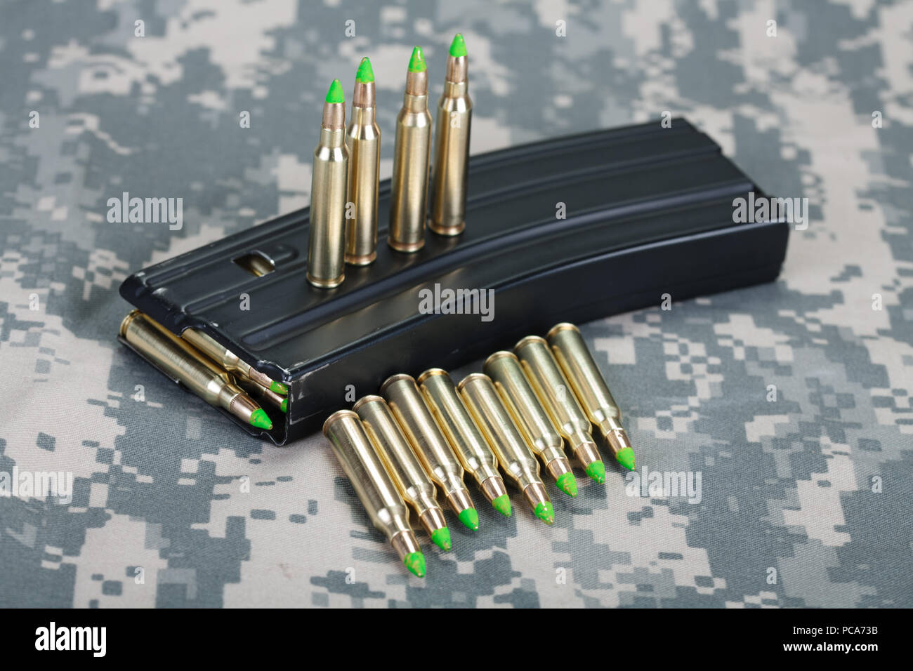 5.56 mm cartridges on US ARMY uniform background Stock Photo - Alamy