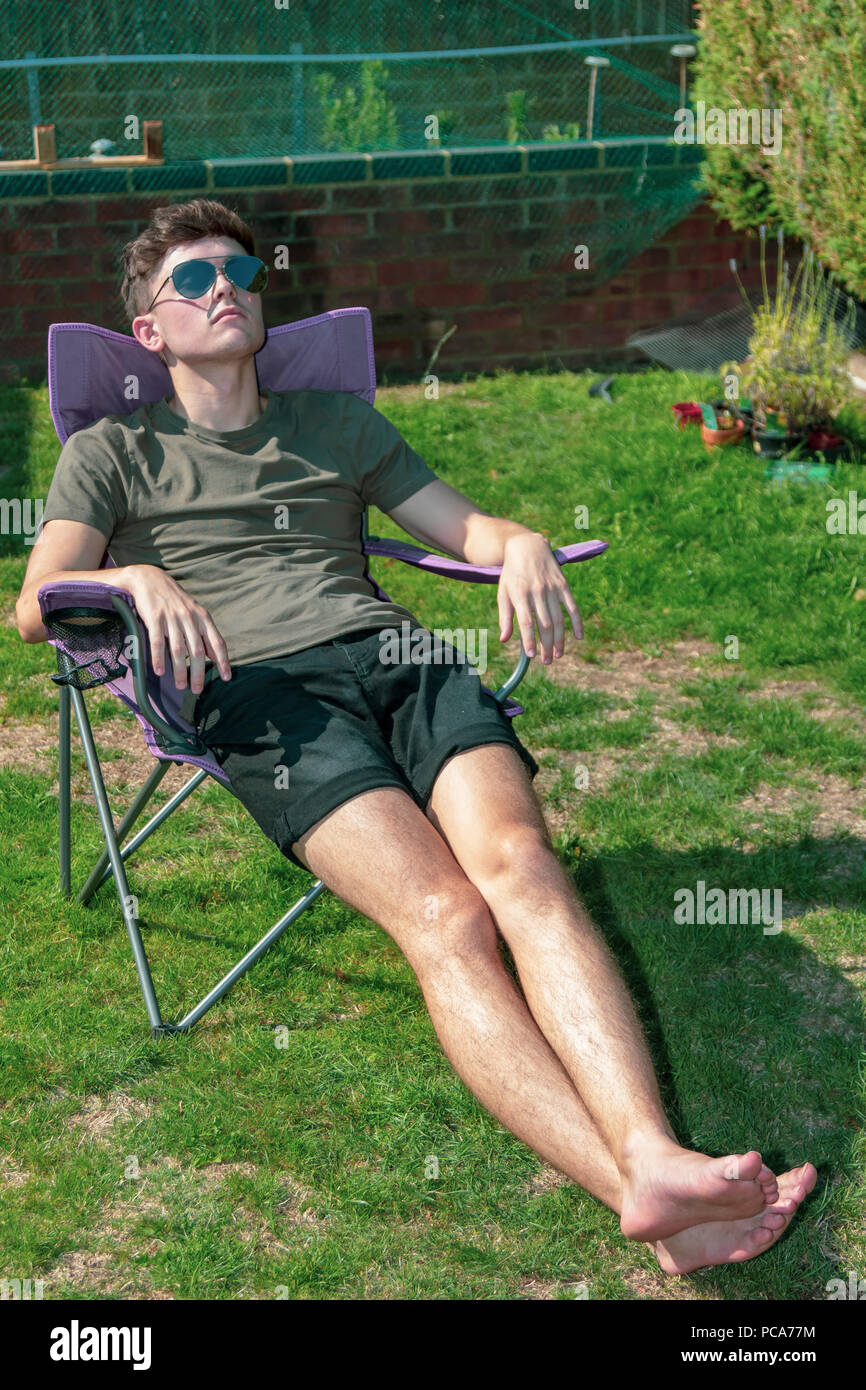 Person Relax Garden Sun Stock Photos & Person Relax Garden Sun Stock ...