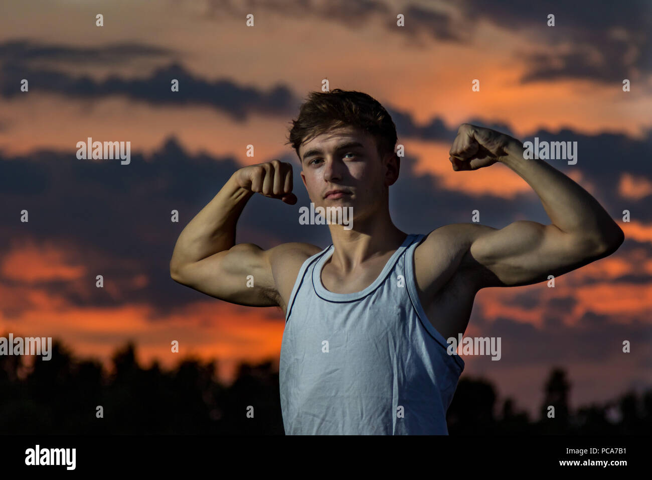Flexing his arm hi-res stock photography and images - Alamy
