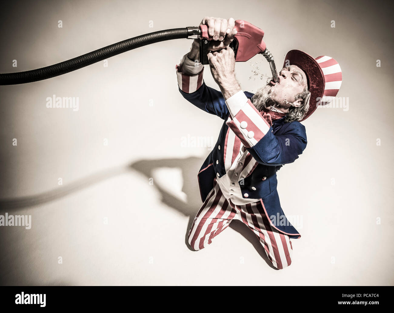 Uncle Sam sucking gasoline from a gas pump nozzle. Addicted to oil ...