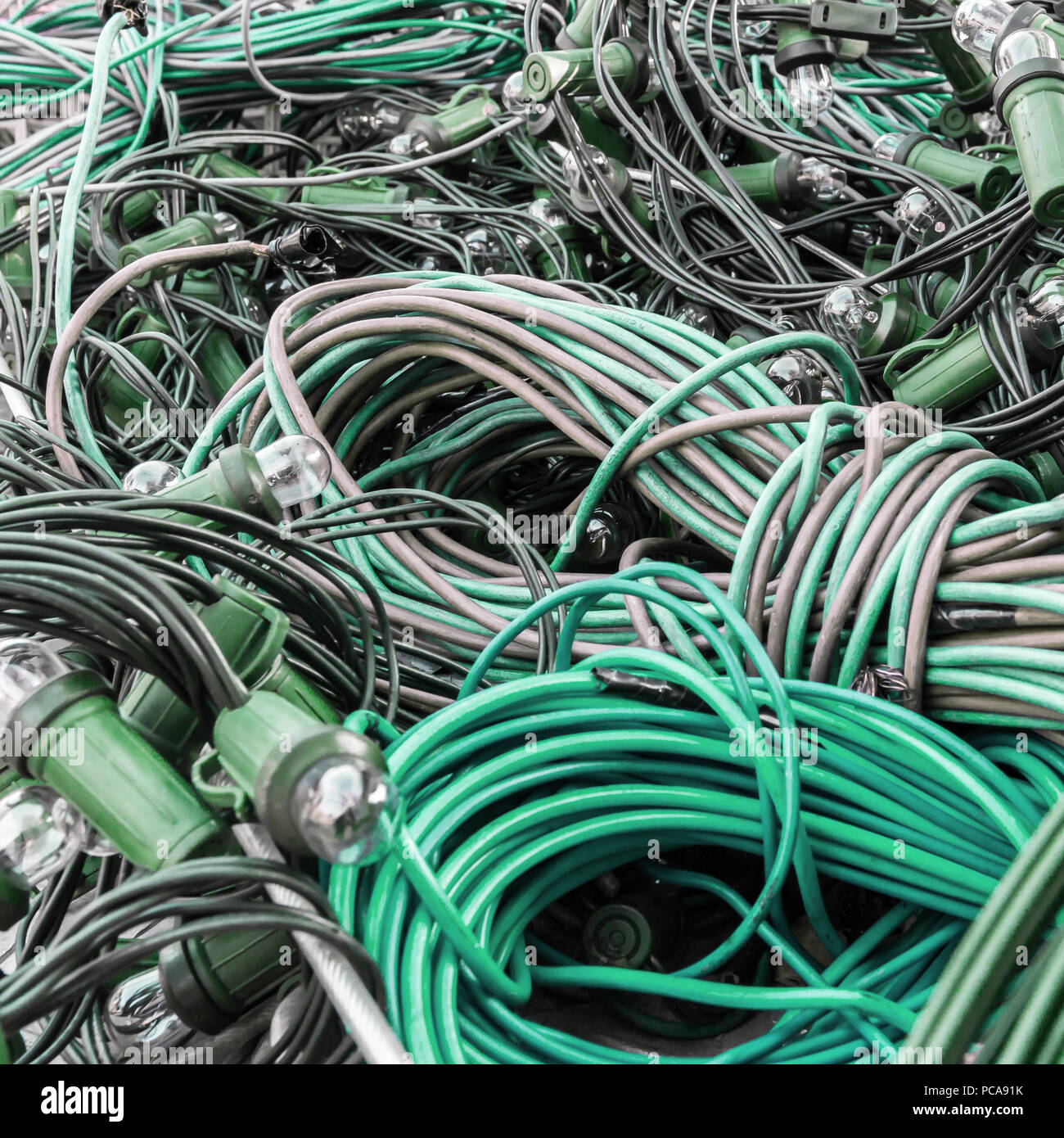 Mess of tangled old-style Christmas lights. Close-up Stock Photo - Alamy