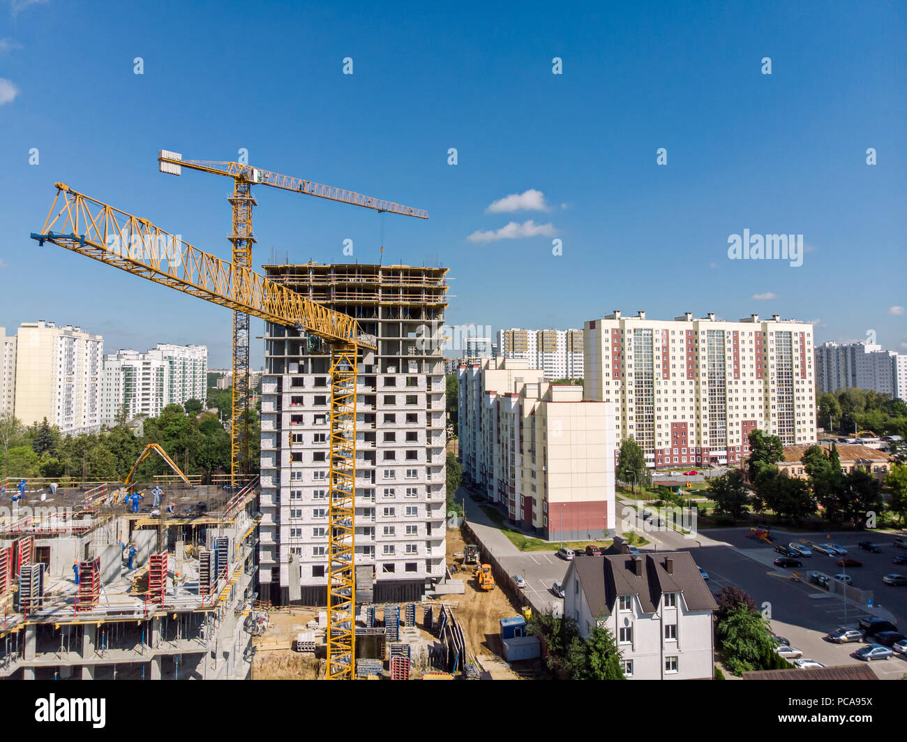 construction of multilevel apartment building. aerial photo of busy ...