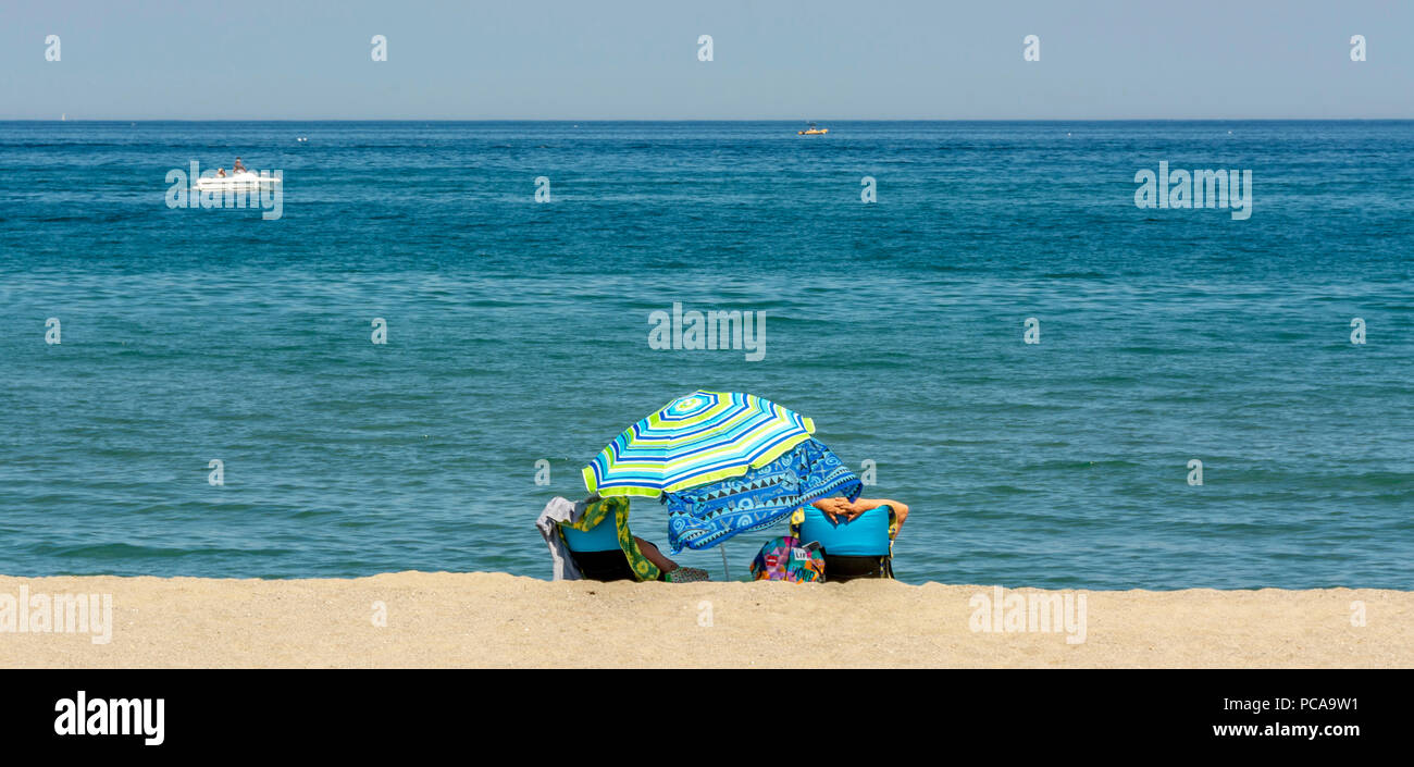 Tourist on the beach of Le Barcares, Pyrenees-Orientales Department ...