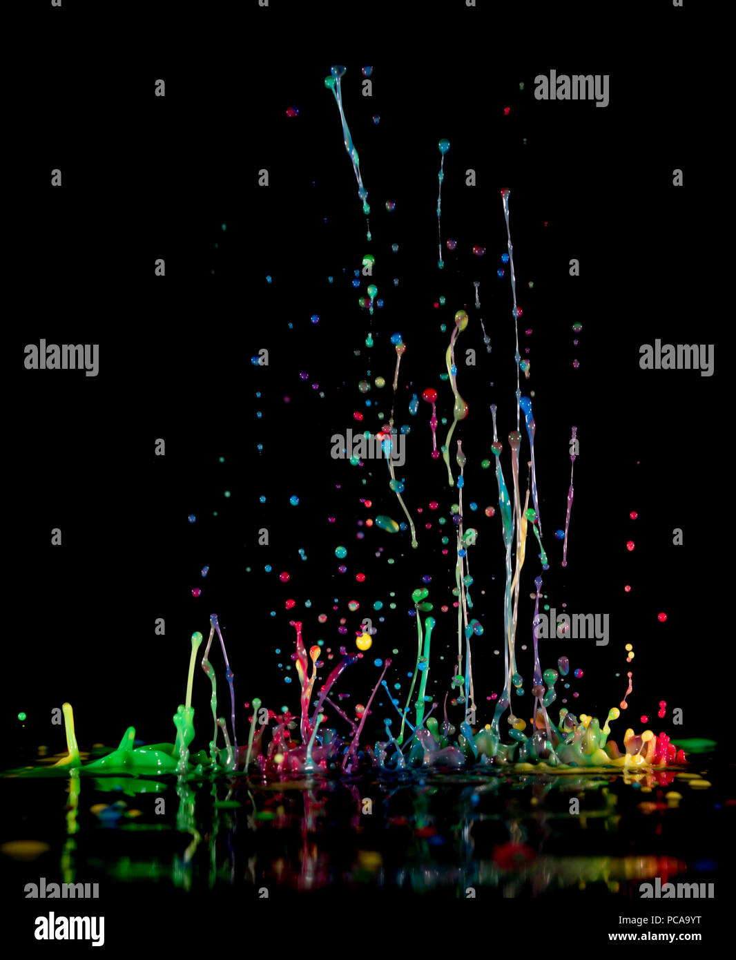 Abstract sculptures of colorful splashes of paint. Dancing liquid on a ...